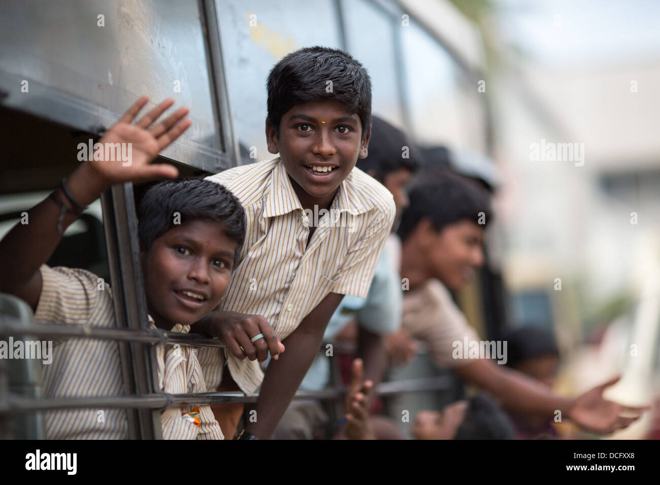 Indian school children look out of the windows of the bus Stock Photo ...