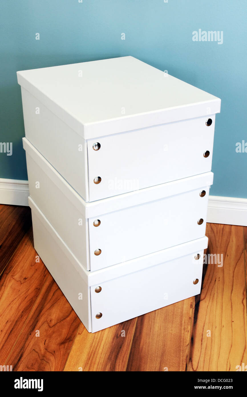Stack of three white boxes Stock Photo - Alamy
