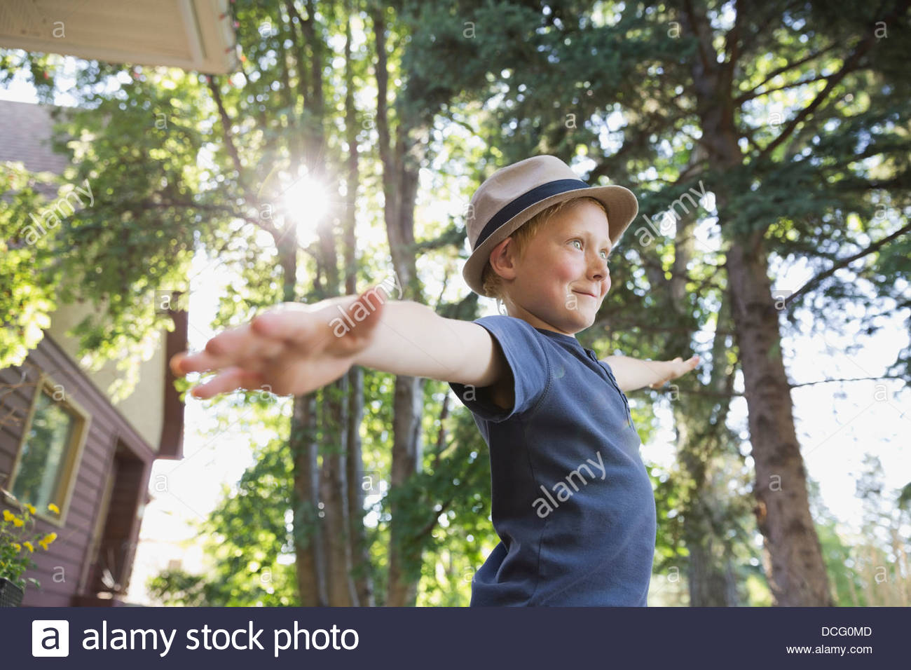 Standing arms up smiling looking away hi-res stock photography and ...