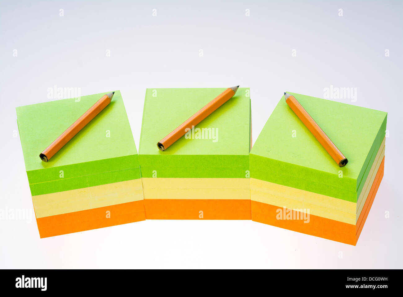 Note pads of paper and pencils Stock Photo - Alamy