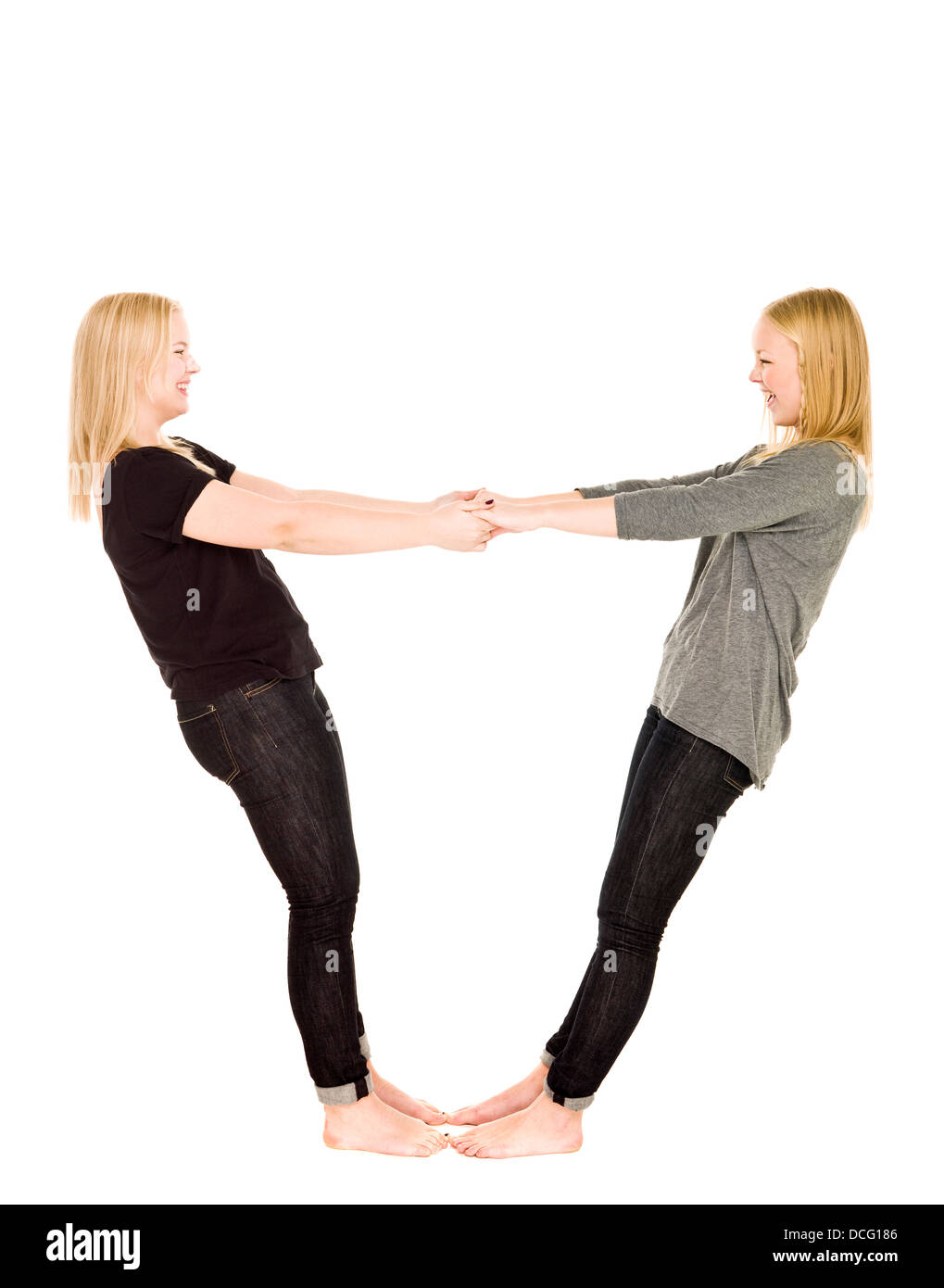 Girls holding hands Stock Photo - Alamy