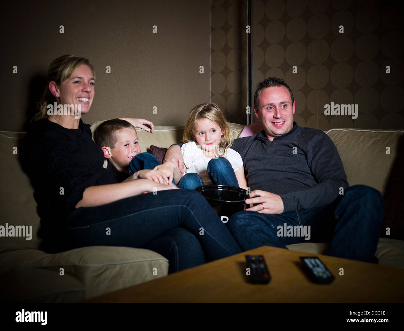 Family in front of the TV Stock Photo - Alamy