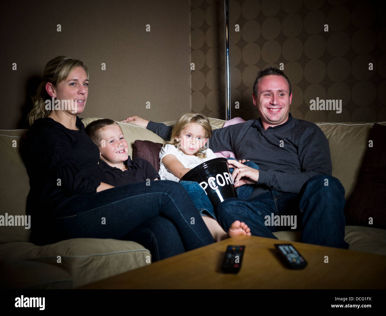 Family in front of the TV Stock Photo - Alamy