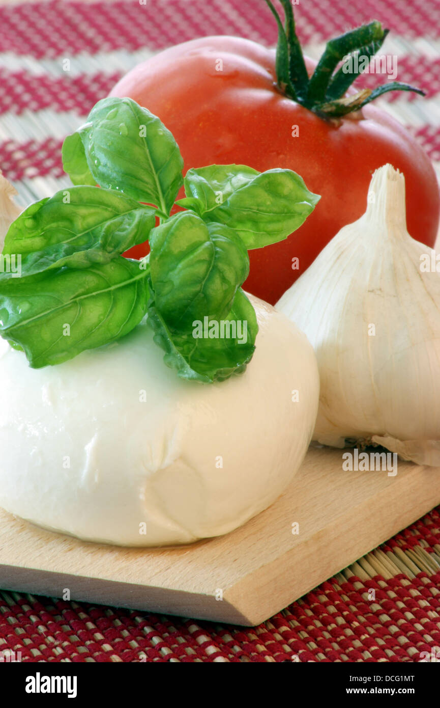 delicious mozzarella with fresh organic basil leaf Stock Photo - Alamy