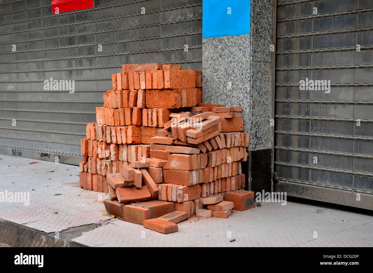 Pile of red bricks ready for construction Stock Photo - Alamy