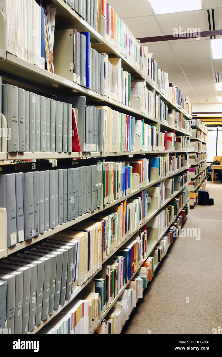 Rows of grey books at library Stock Photo - Alamy