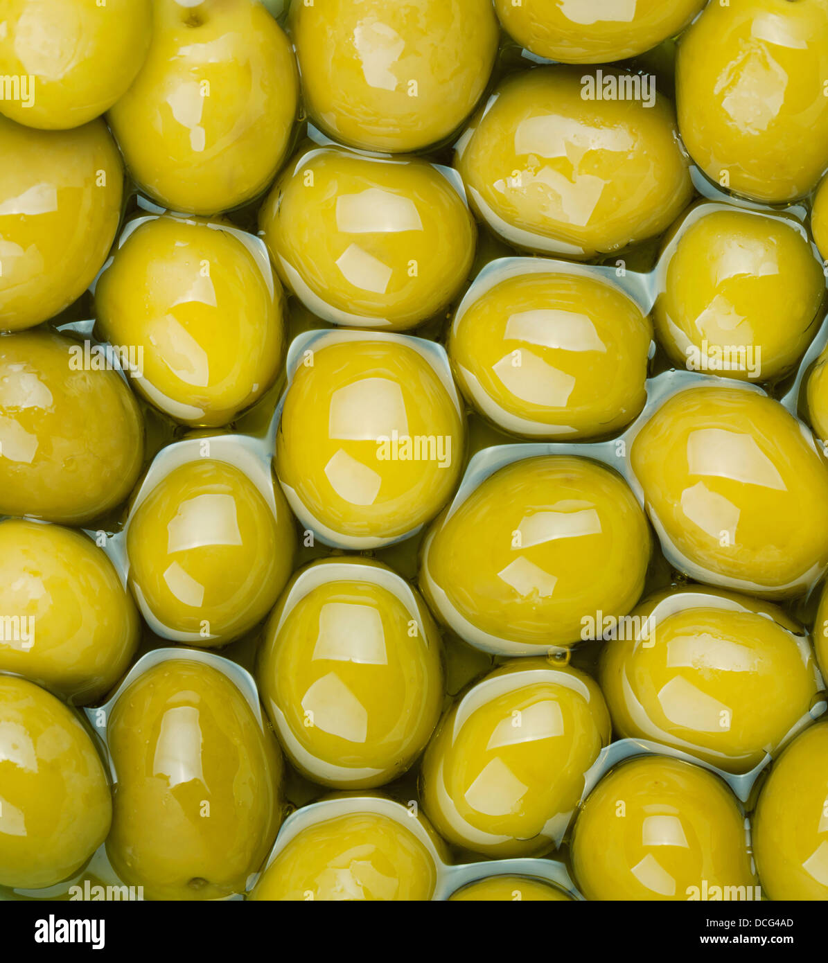 Green olives texture food background Stock Photo - Alamy