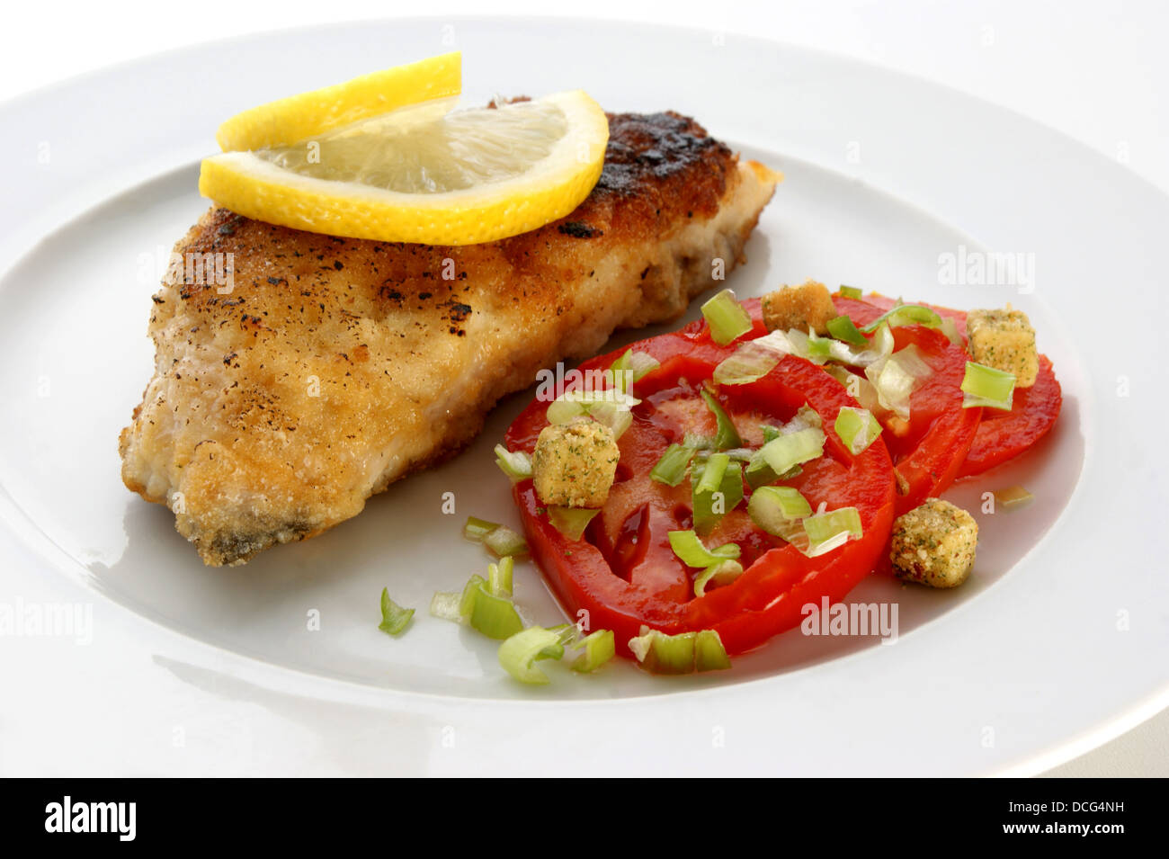 grilled carp fillet with organic vegetable on a plate Stock Photo - Alamy