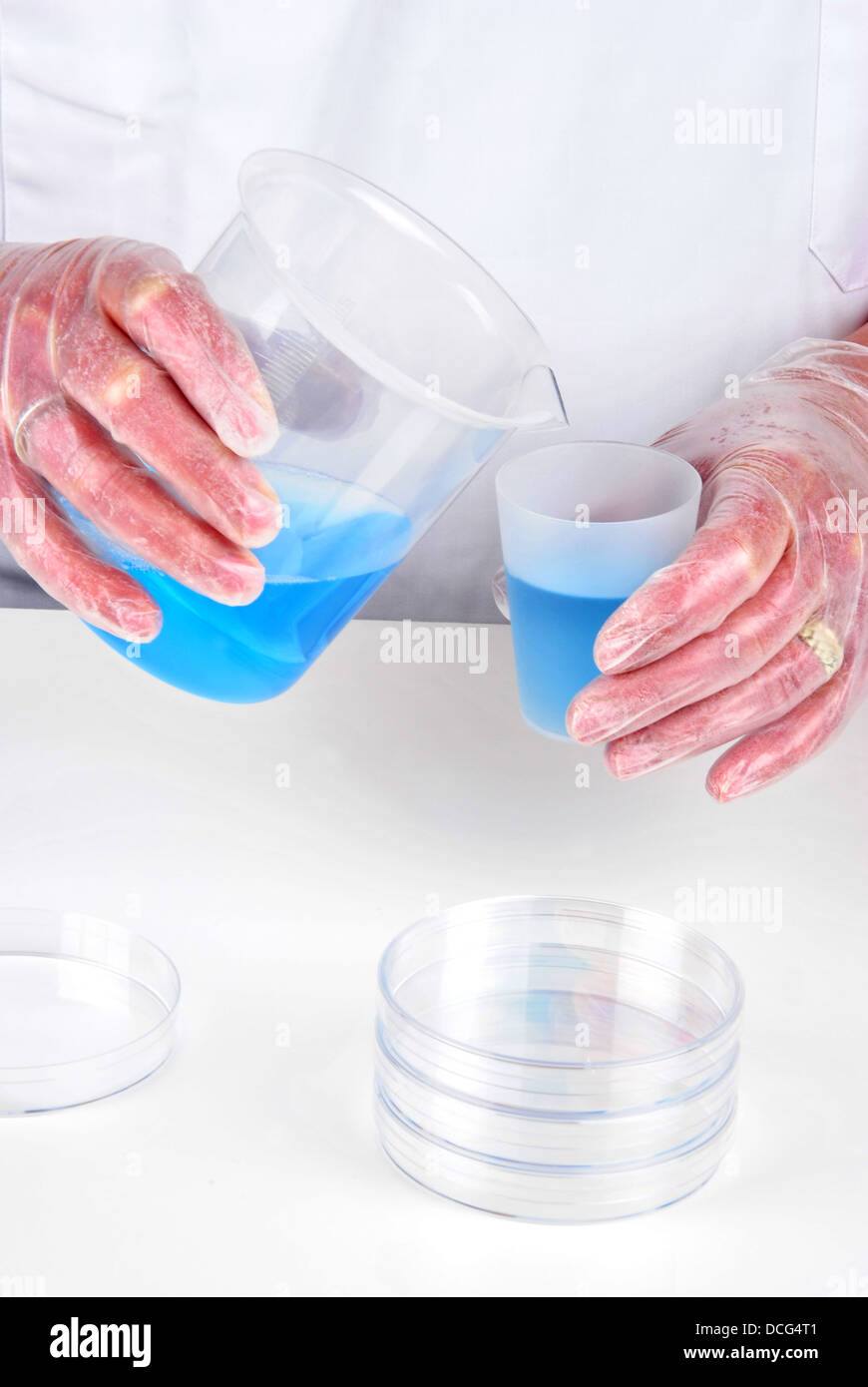 some blue liquid in two chemical container Stock Photo - Alamy