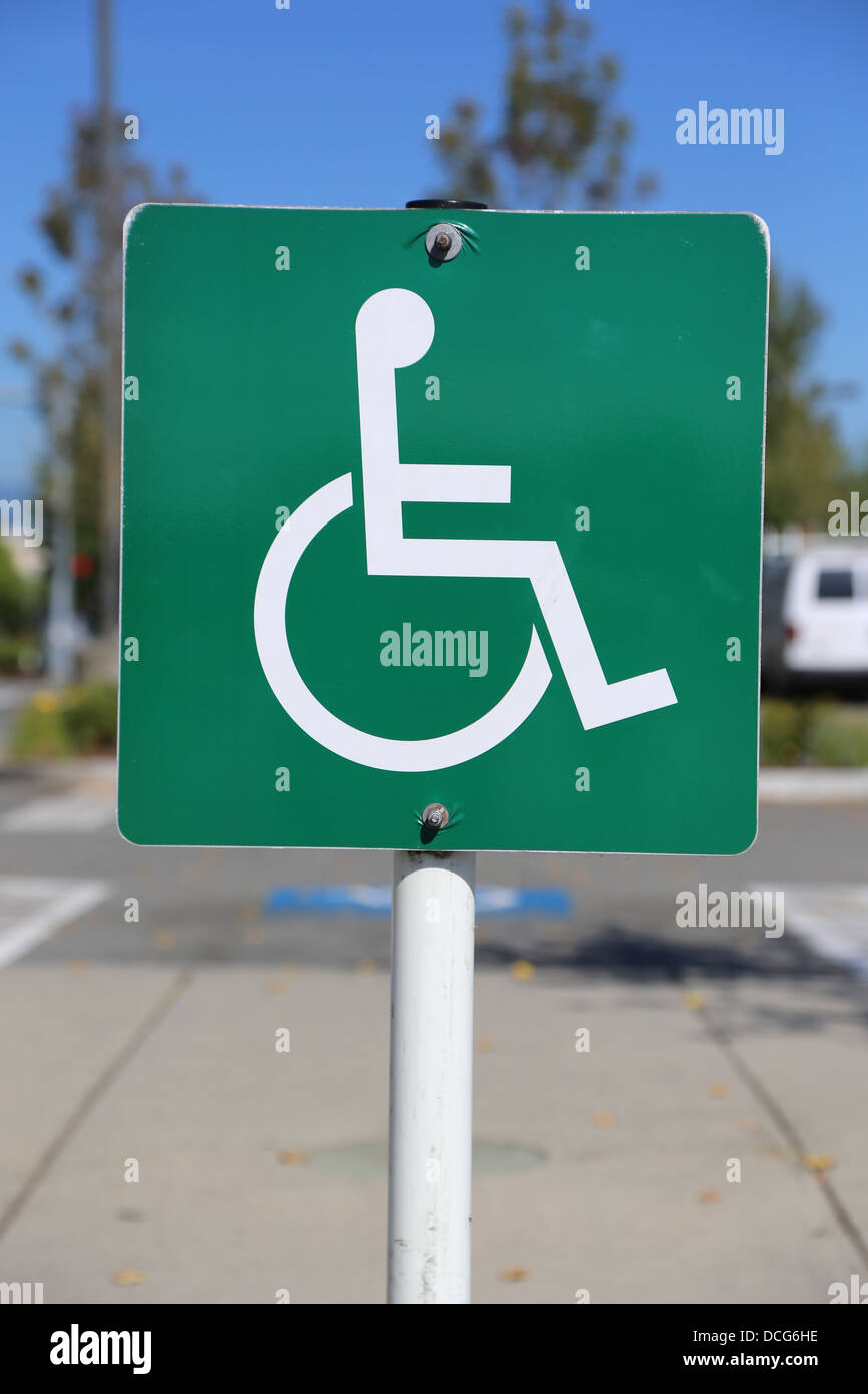 Disable parking sign with nature background Stock Photo - Alamy