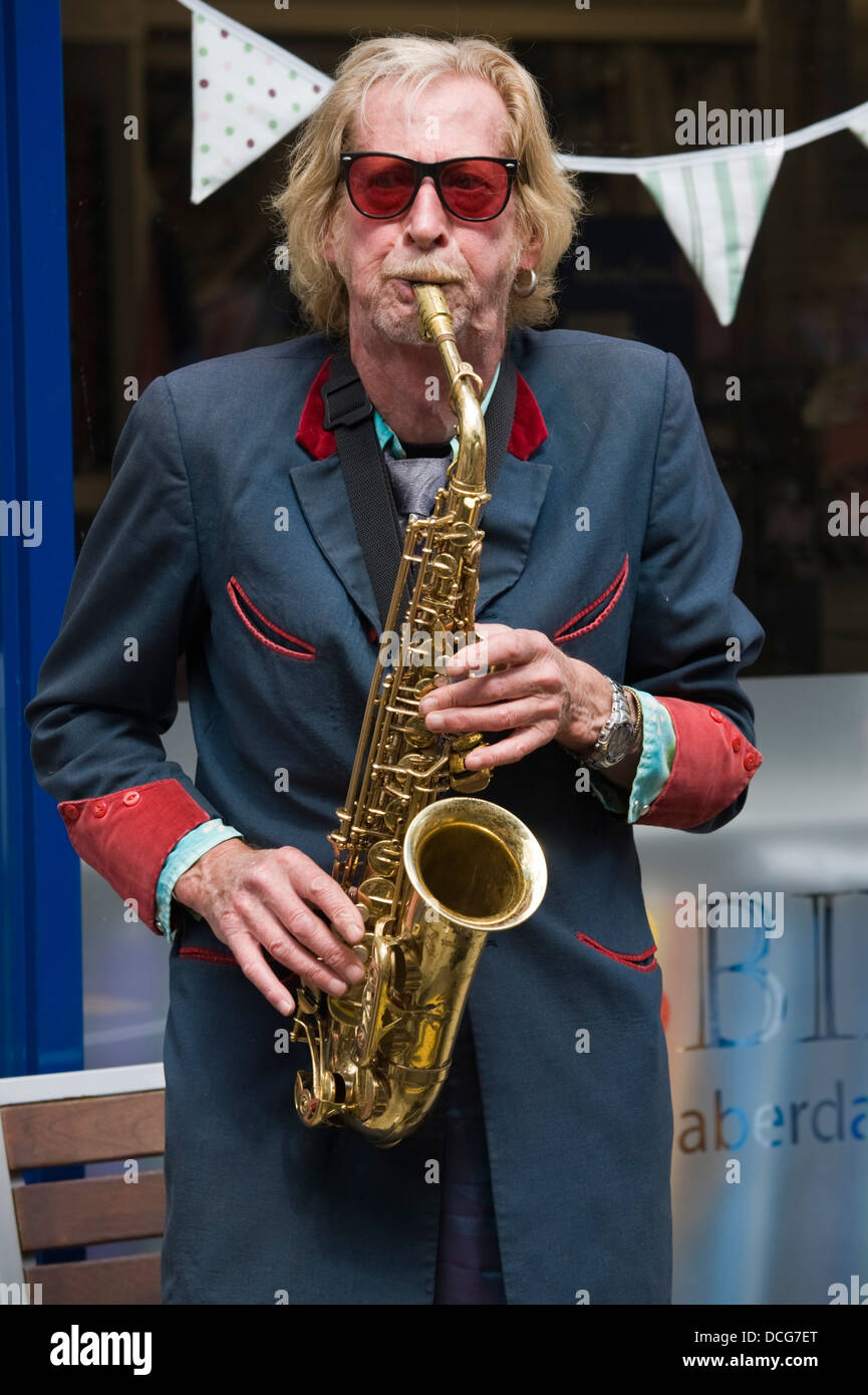 Nik Turner founder member of Hawkwind busking on the street during ...