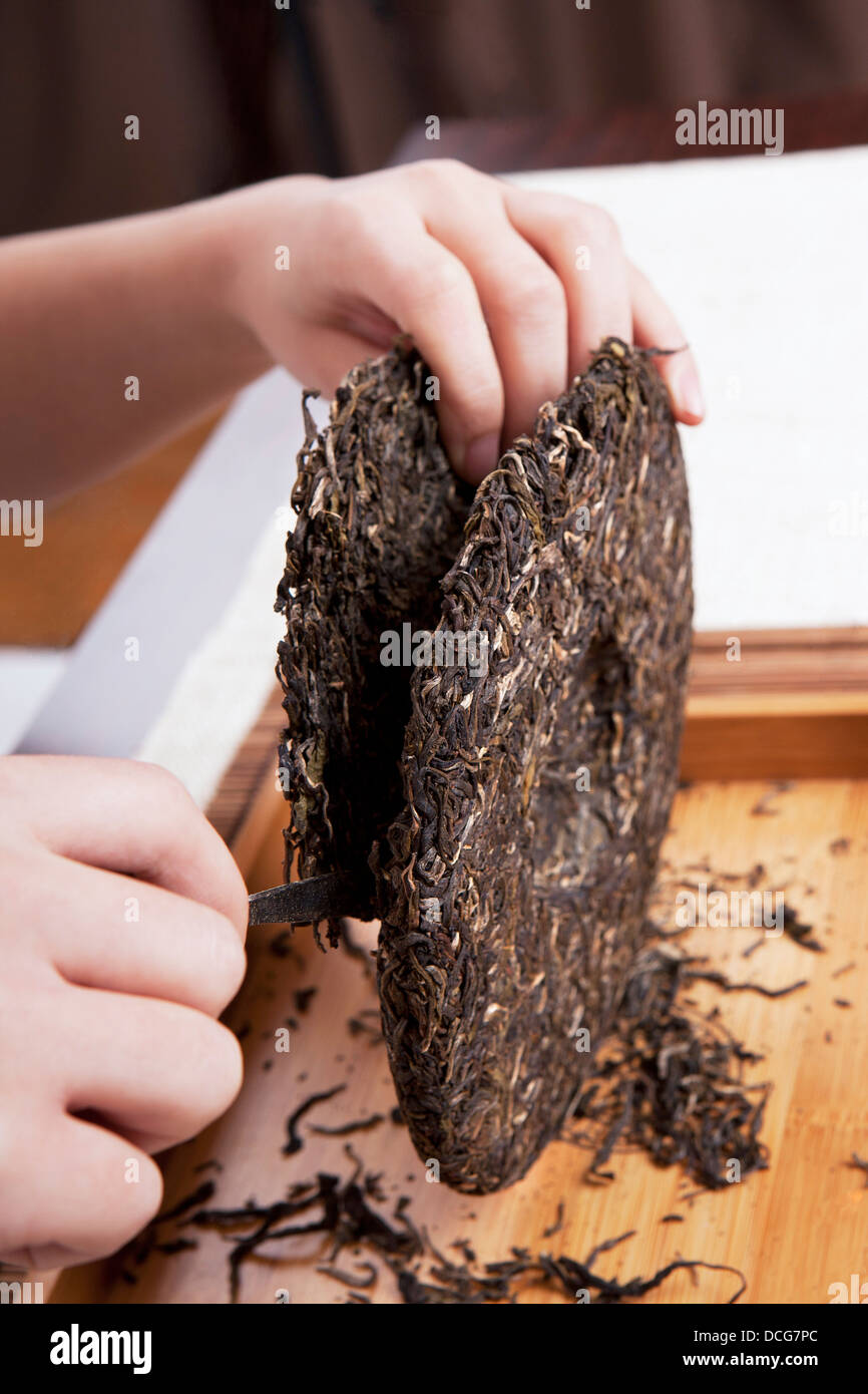 Professional cutting Pu'er tea Stock Photo - Alamy