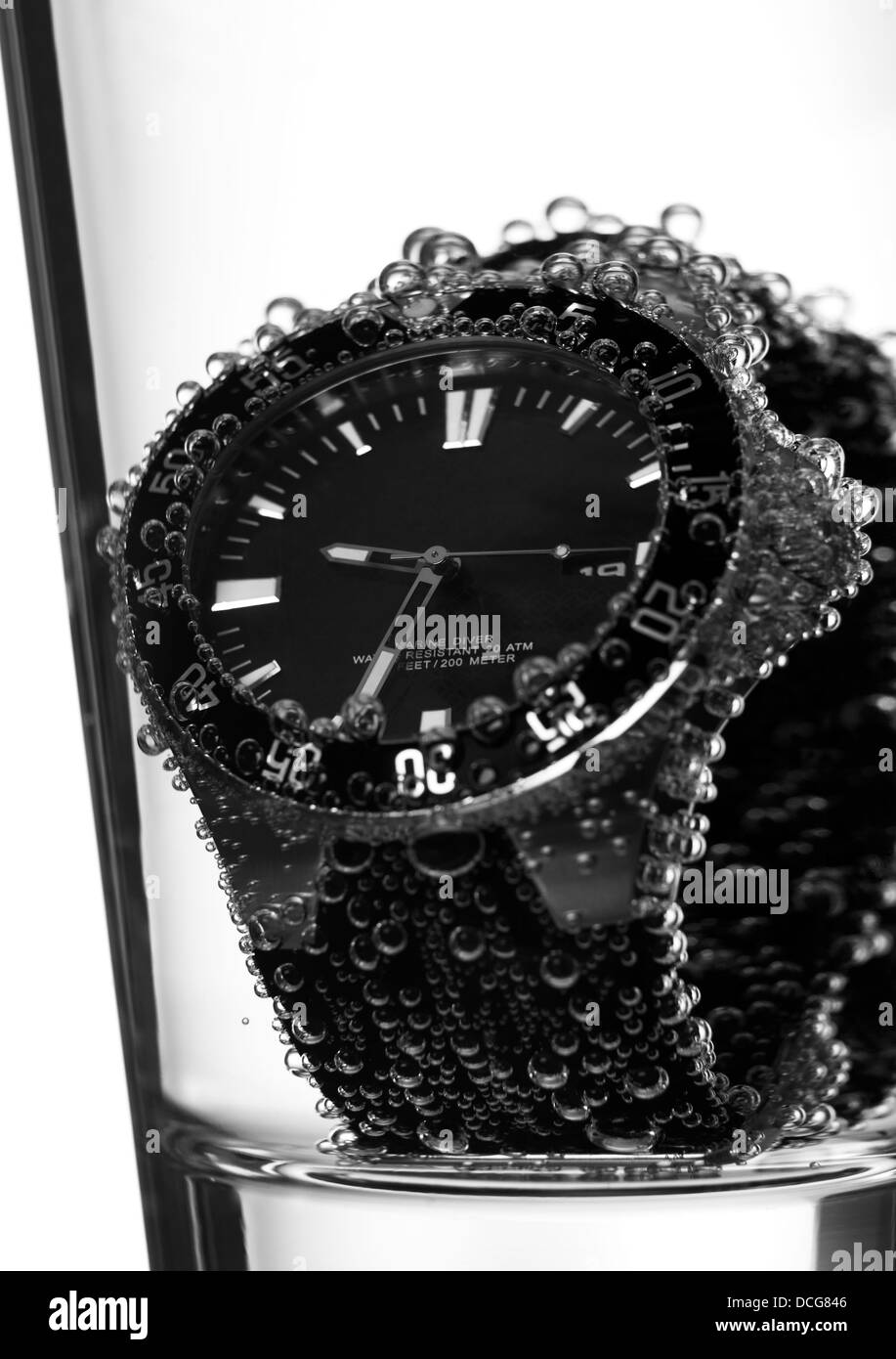 a glass with a clock inside Stock Photo - Alamy