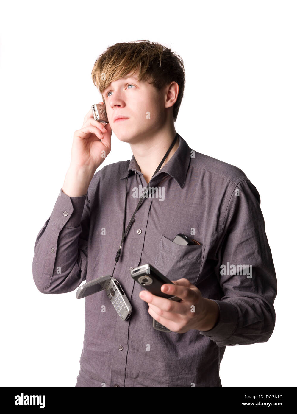 Young man with telephones Stock Photo - Alamy
