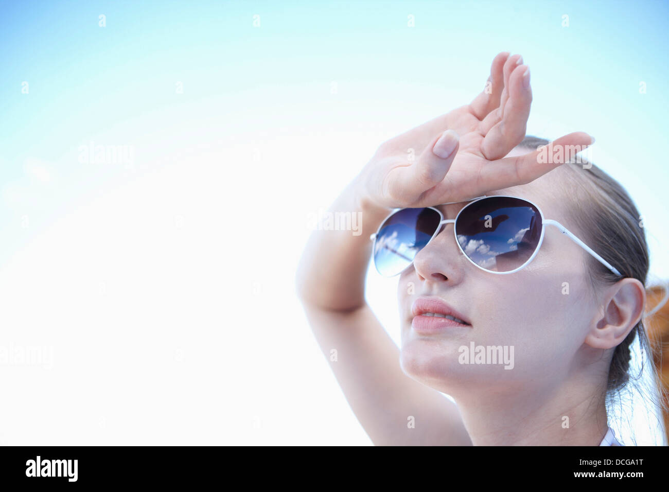 close up shot of a lady in sunglasses under the sun Stock Photo - Alamy