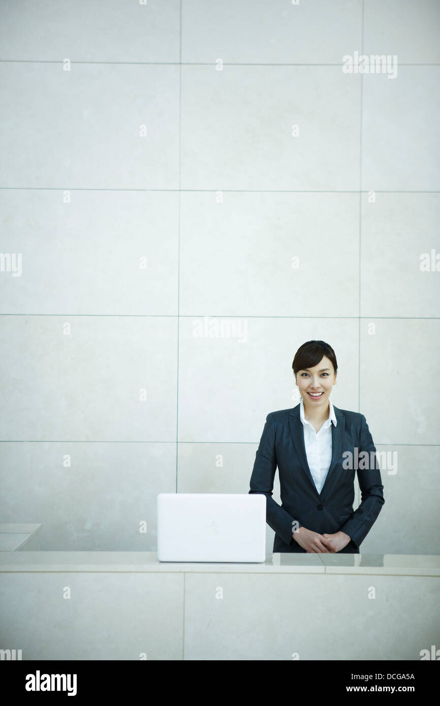 a woman standing in the reception Stock Photo - Alamy