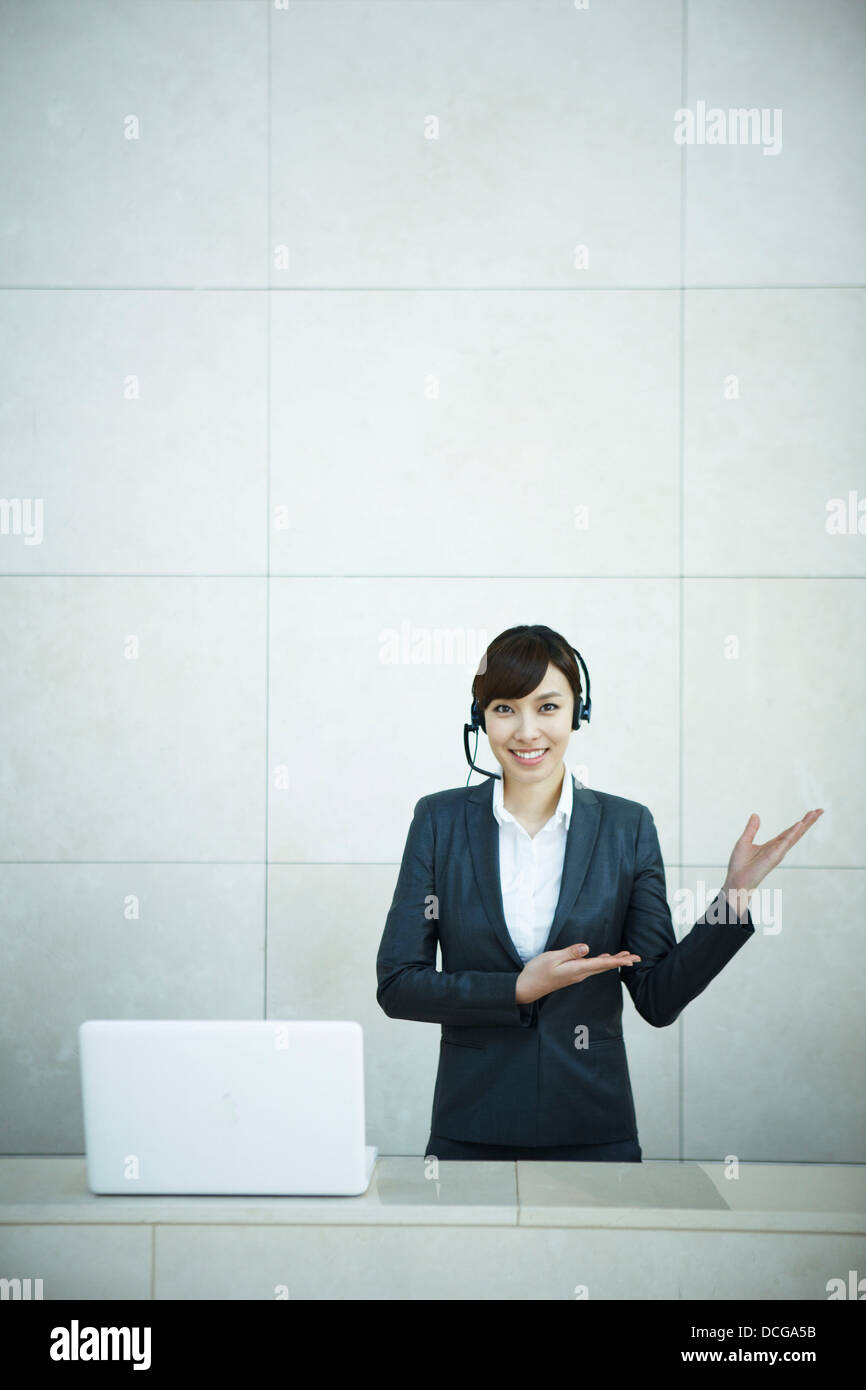 a woman standing in the reception Stock Photo - Alamy