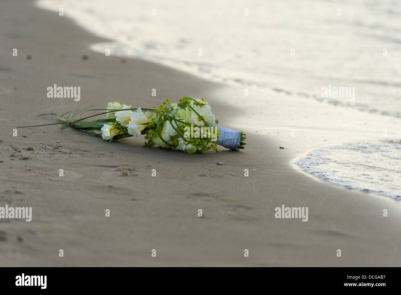 Flowers laid on beach Stock Photo - Alamy