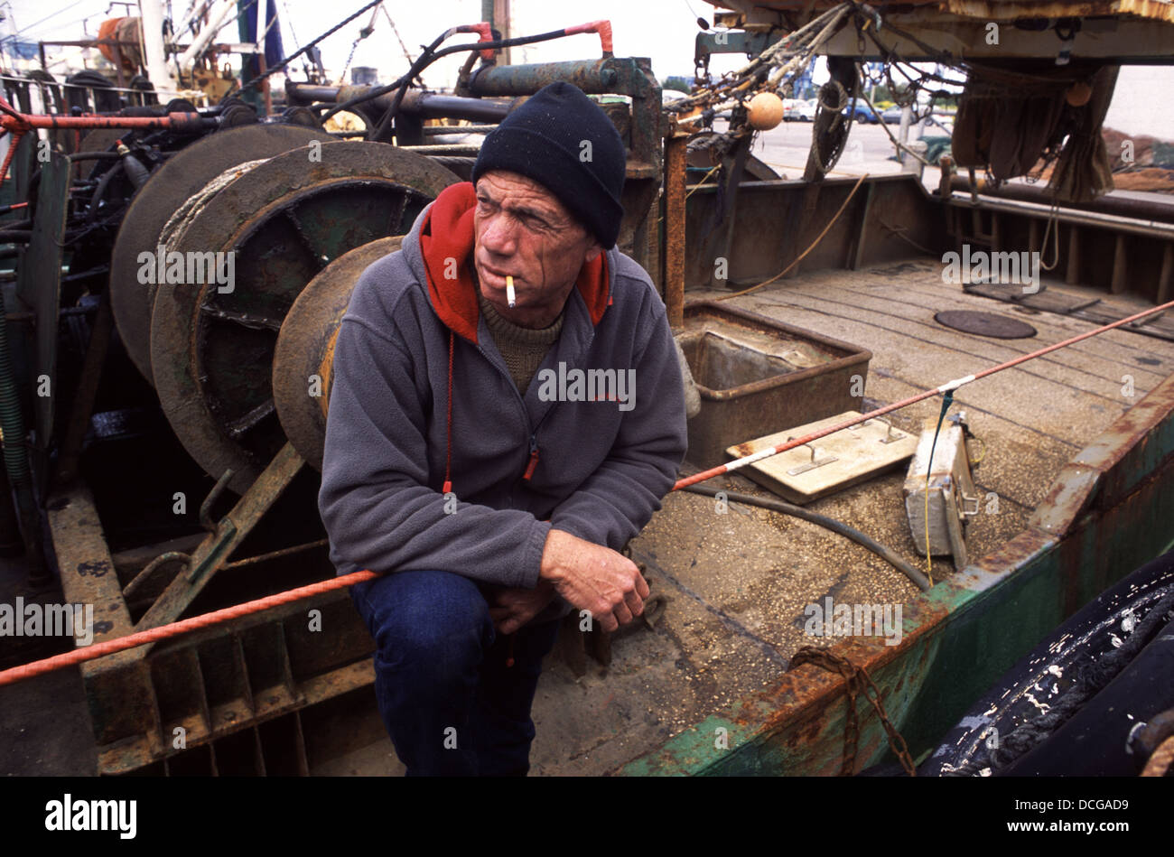 An Israeli Arab fisherman in a fishing trawler at HaKishon port located ...