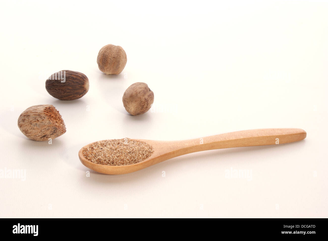 nutmeg also some nutmeg powder and one spoon Stock Photo - Alamy