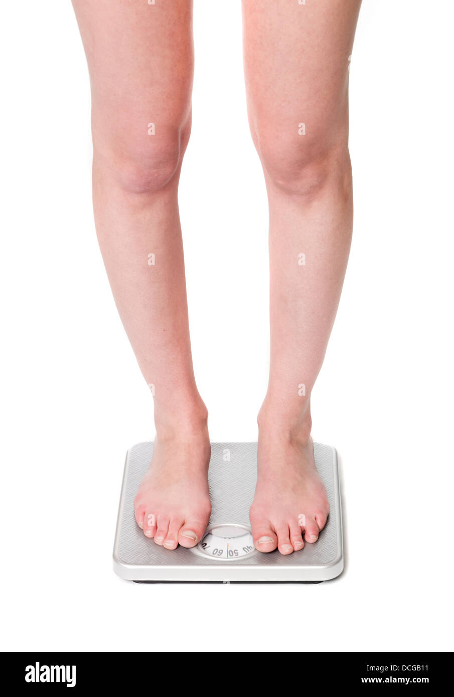 Standing on a weightscale Stock Photo - Alamy