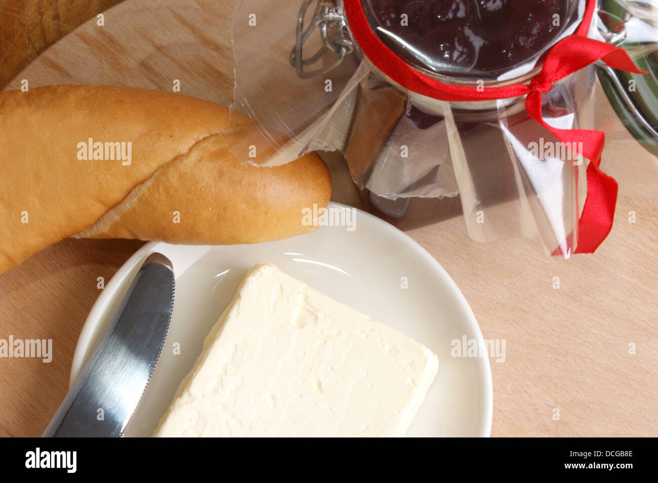 breakfast with bread roll and organic butter Stock Photo - Alamy