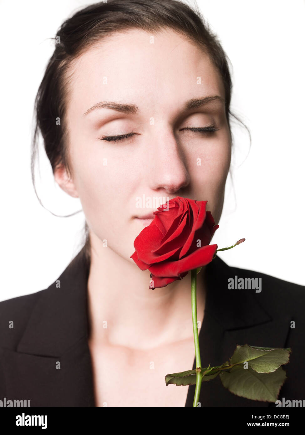 Woman smells a rose Stock Photo - Alamy