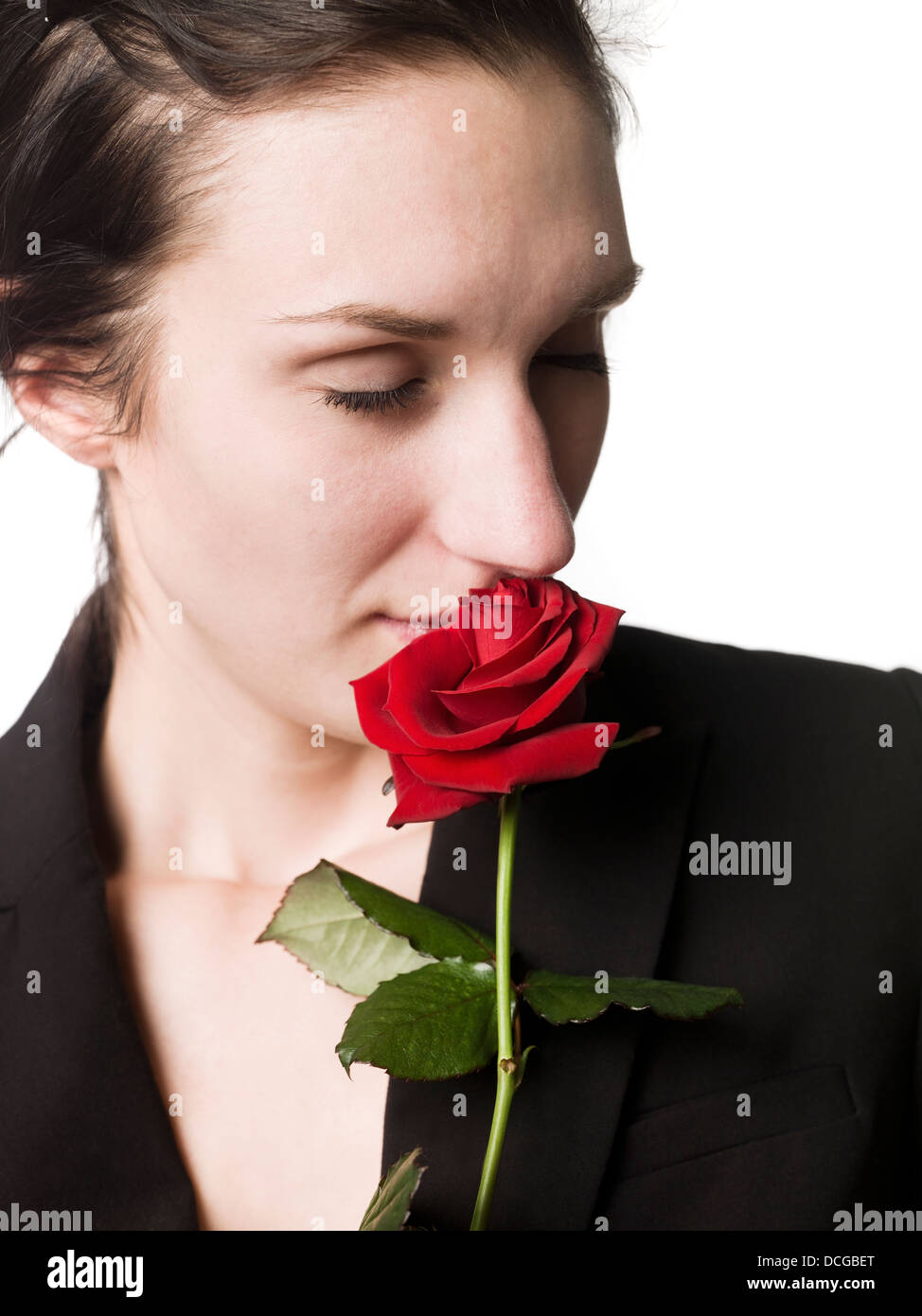 Woman smell a rose Stock Photo - Alamy
