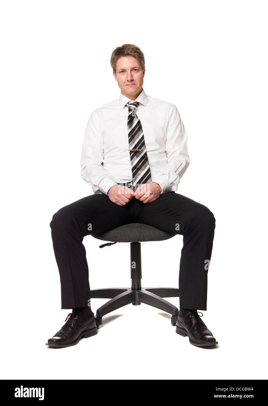 Man siting on an office chair Stock Photo - Alamy