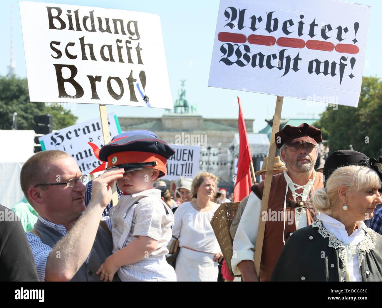 Berlin, Germany. 17th Aug, 2013. Dressed as members of the labor ...