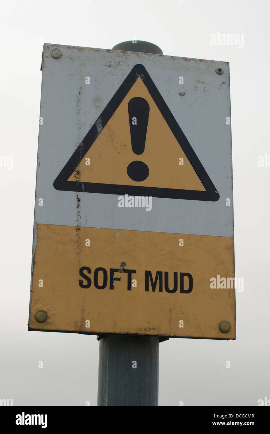 A 'soft mud' sign is pictured on the bank of the River Thames Stock ...
