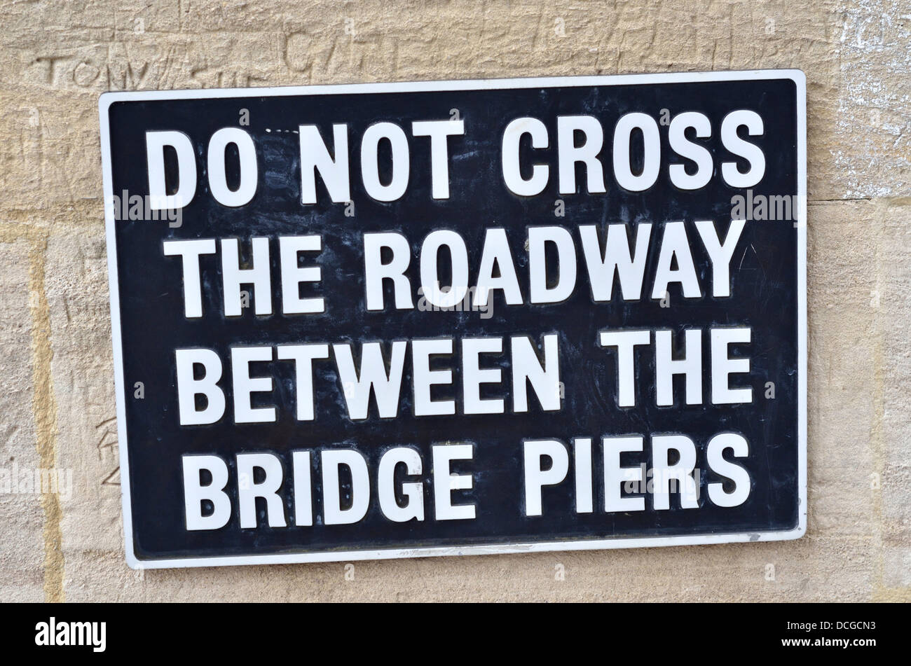 "Do not cross the roadway between the bridge piers" sign Stock Photo ...