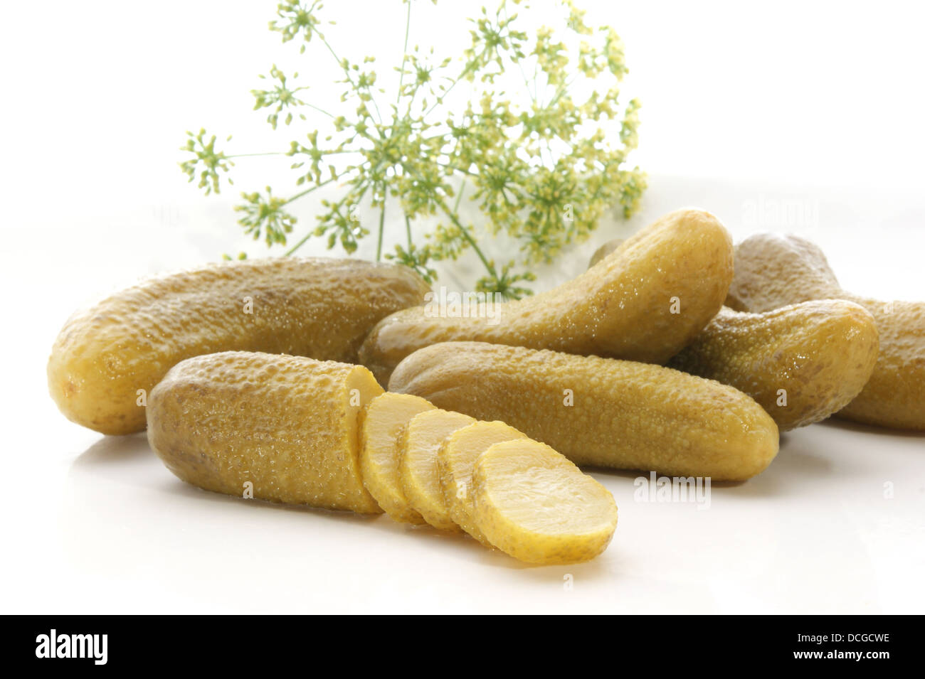 one sour gherkin cut half into slices Stock Photo - Alamy