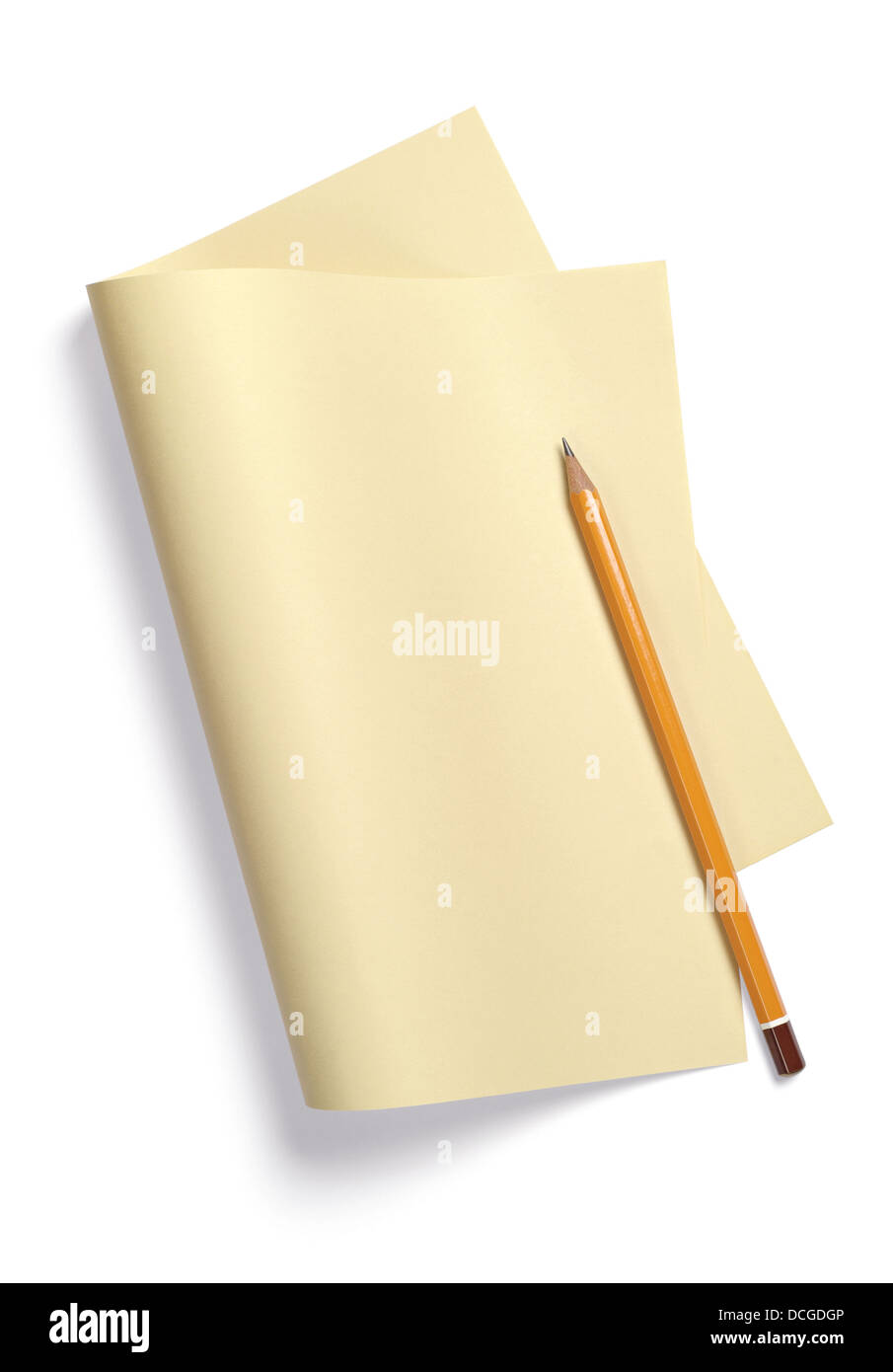 Yellow sheet of paper, folded in half on white Stock Photo - Alamy