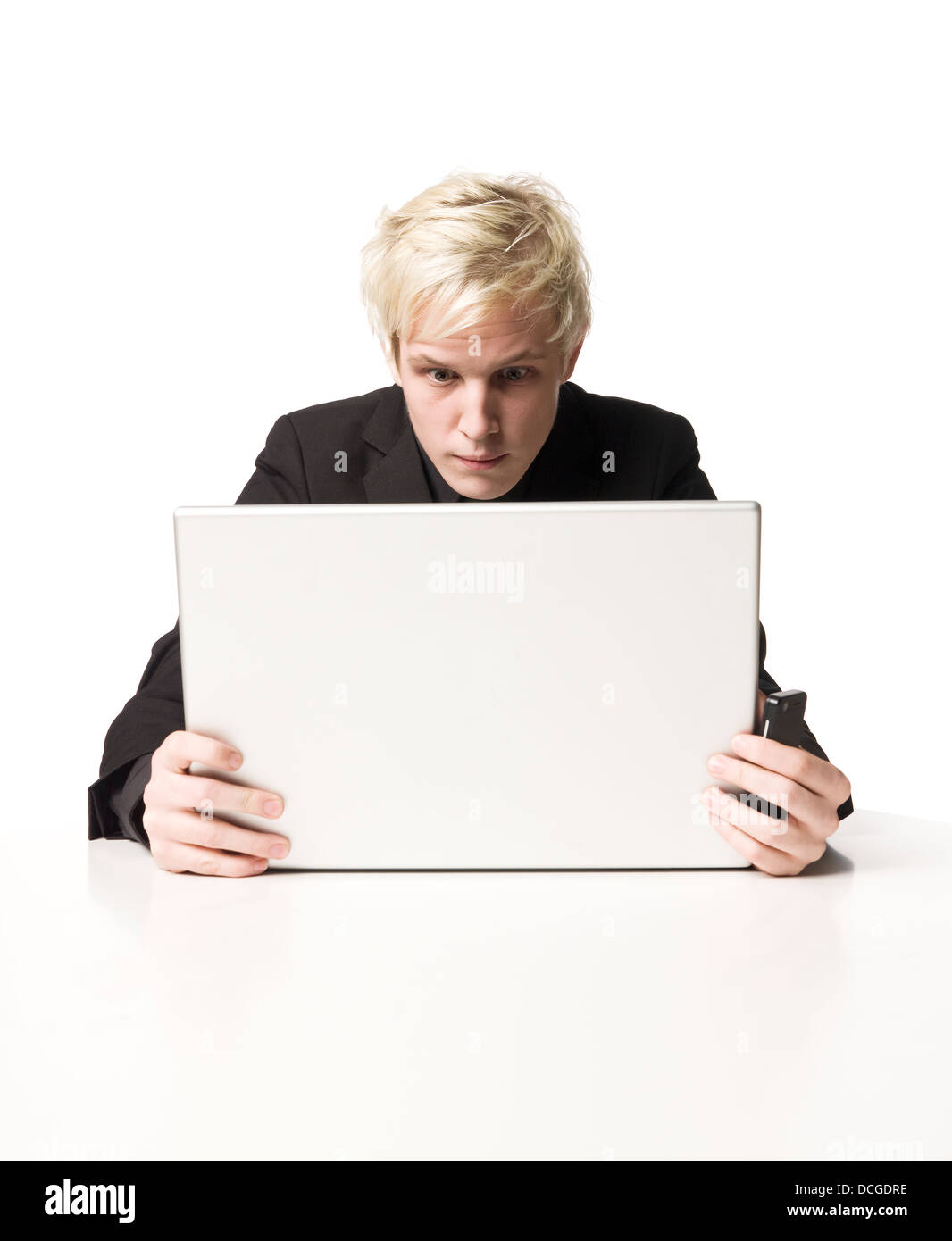 Man looking on a computer Stock Photo - Alamy