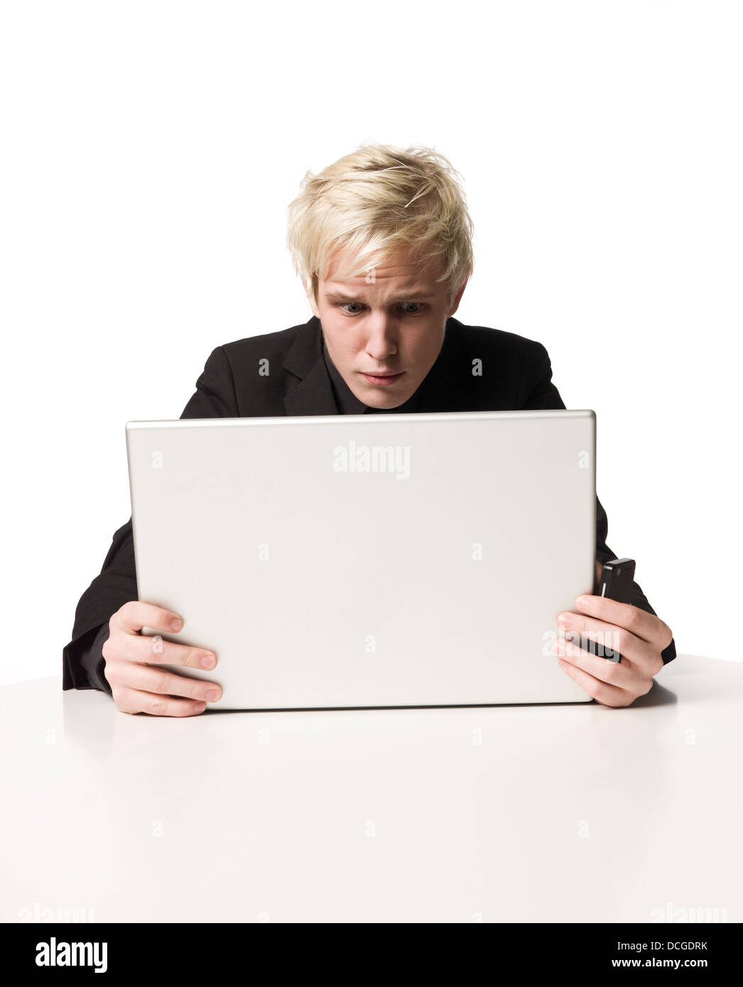 Boy looking on a computer Stock Photo - Alamy