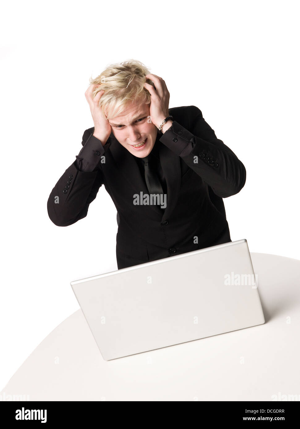 Man looking on a computer Stock Photo - Alamy