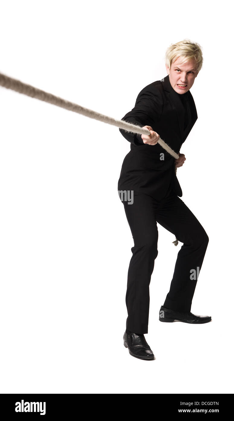 Boy pulling a rope Stock Photo - Alamy