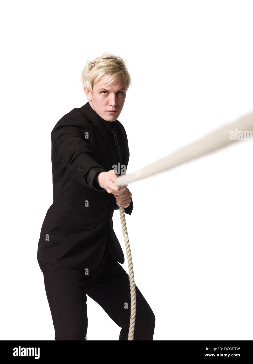 Boy pulling a rope Stock Photo - Alamy