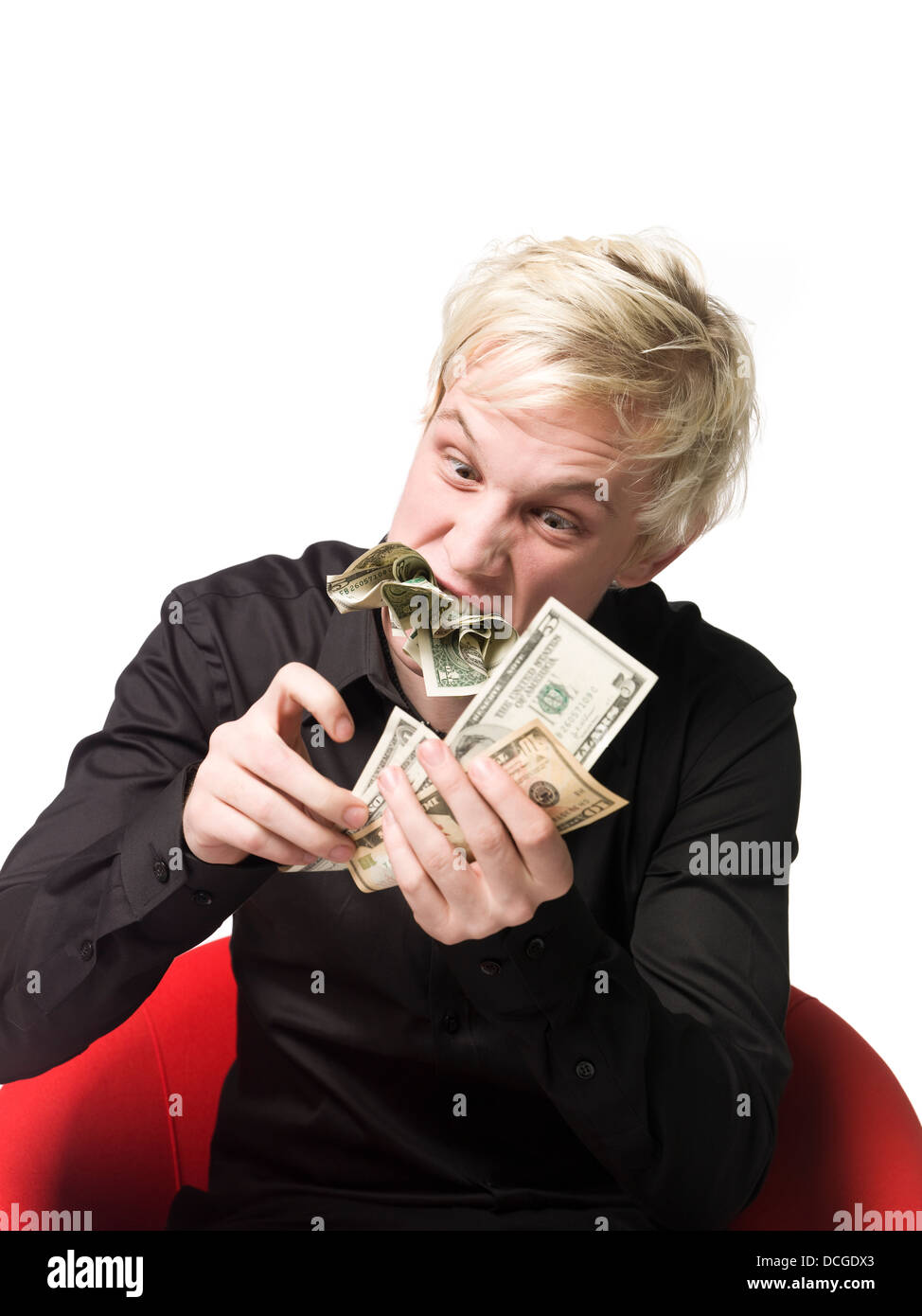 Man eating money Stock Photo - Alamy