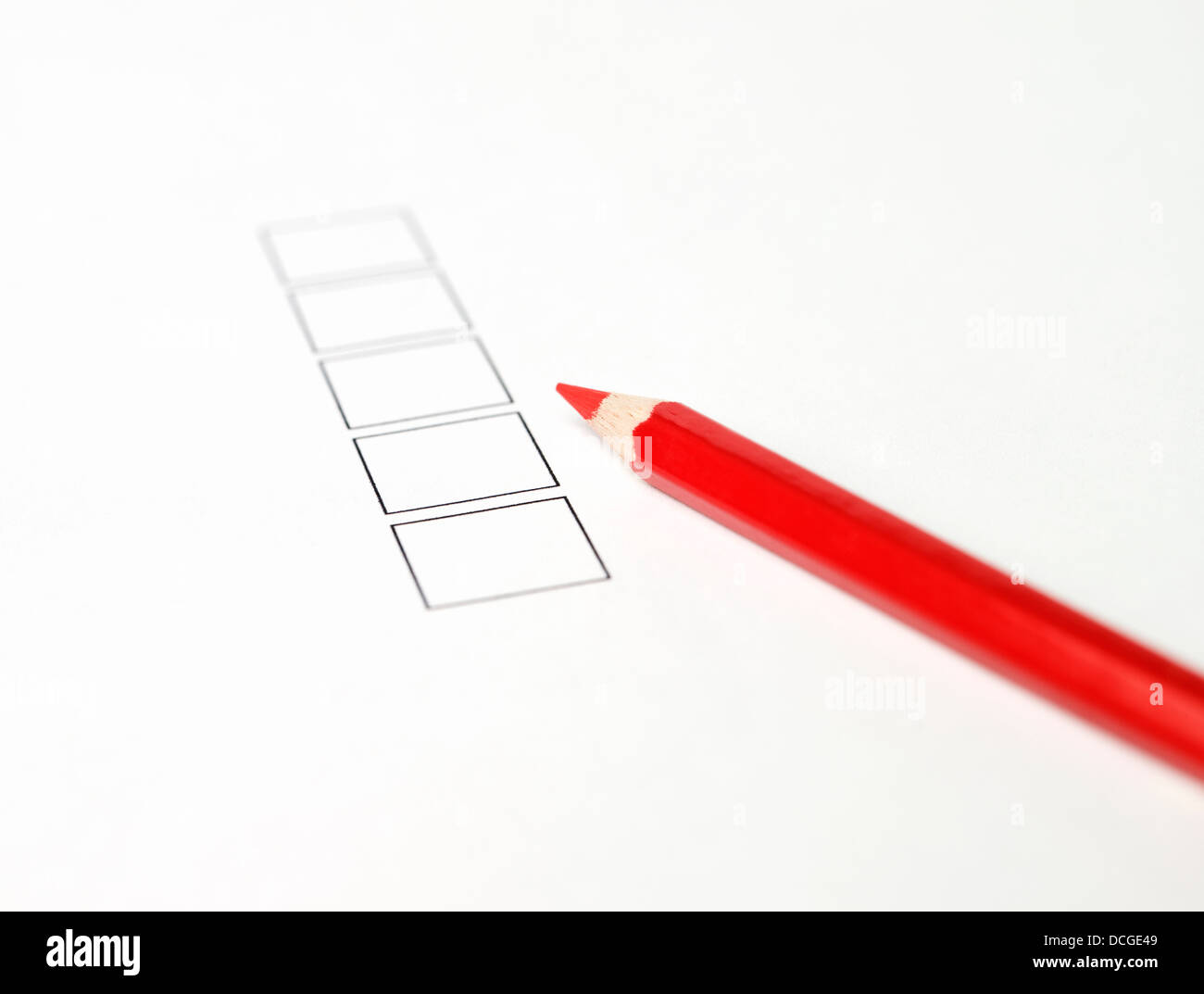 Red pencil and check boxes Stock Photo - Alamy