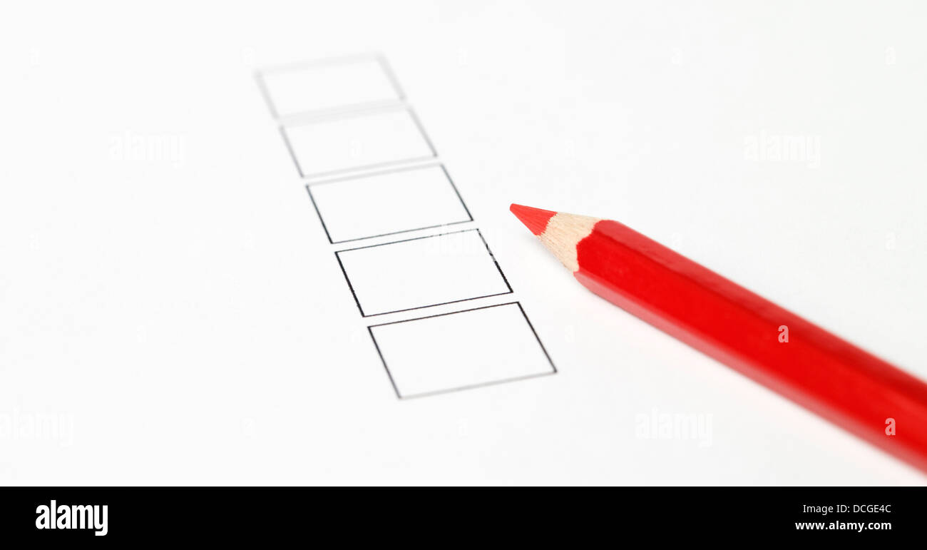 Red pencil and check boxes Stock Photo - Alamy