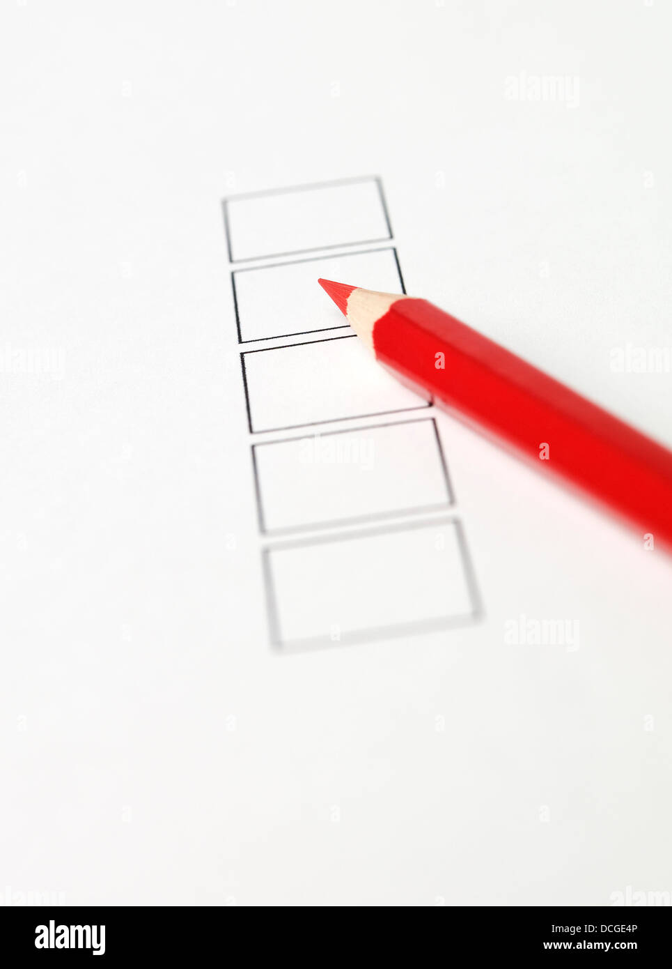 Red pencil and check boxes Stock Photo - Alamy