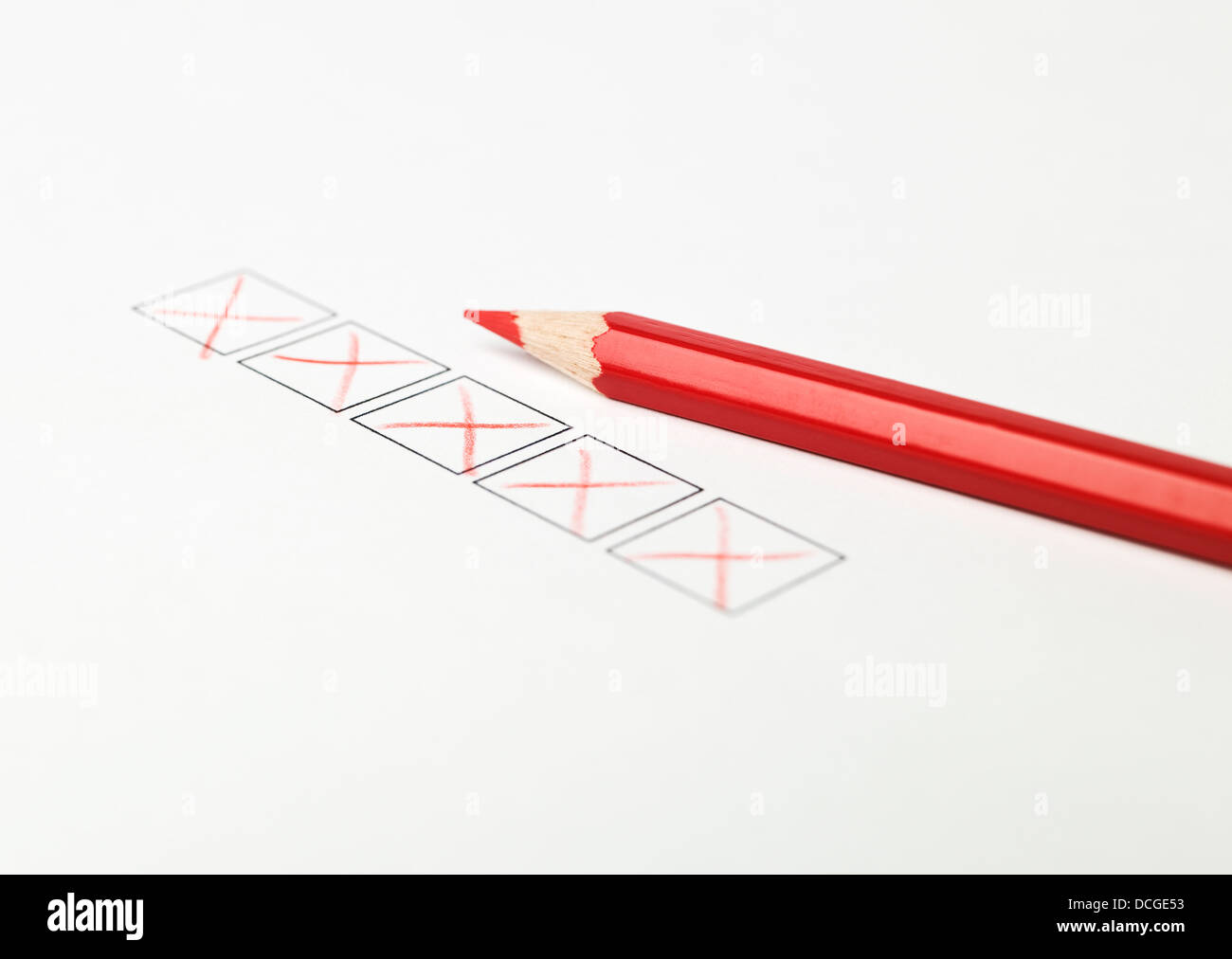 Red pencil and check boxes Stock Photo - Alamy