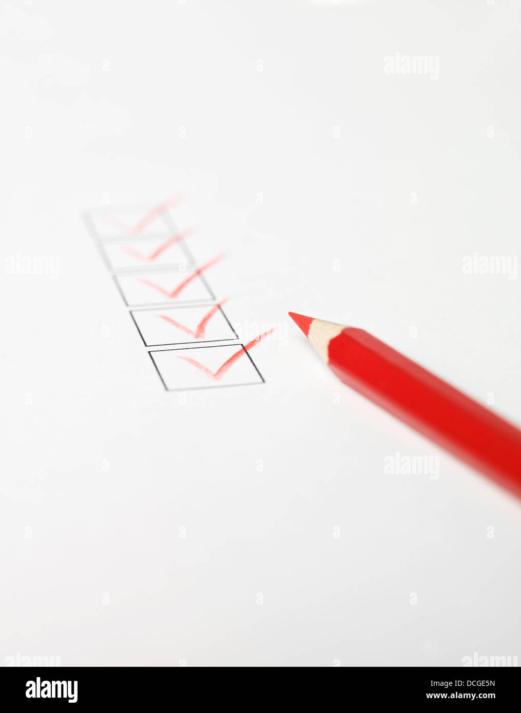 Red pen with check boxes Stock Photo - Alamy