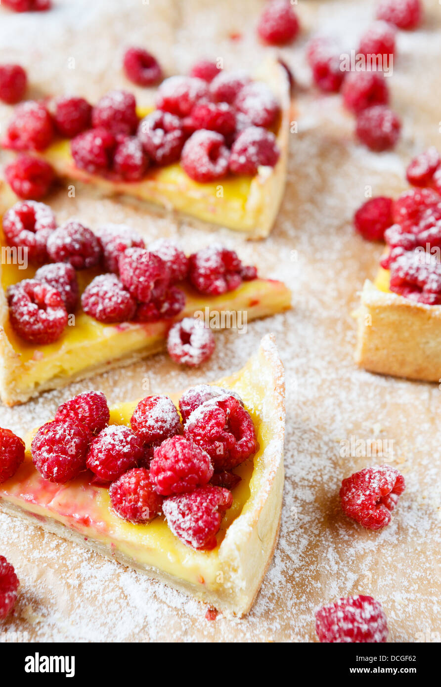 raspberry tart cut into pieces, food Stock Photo - Alamy