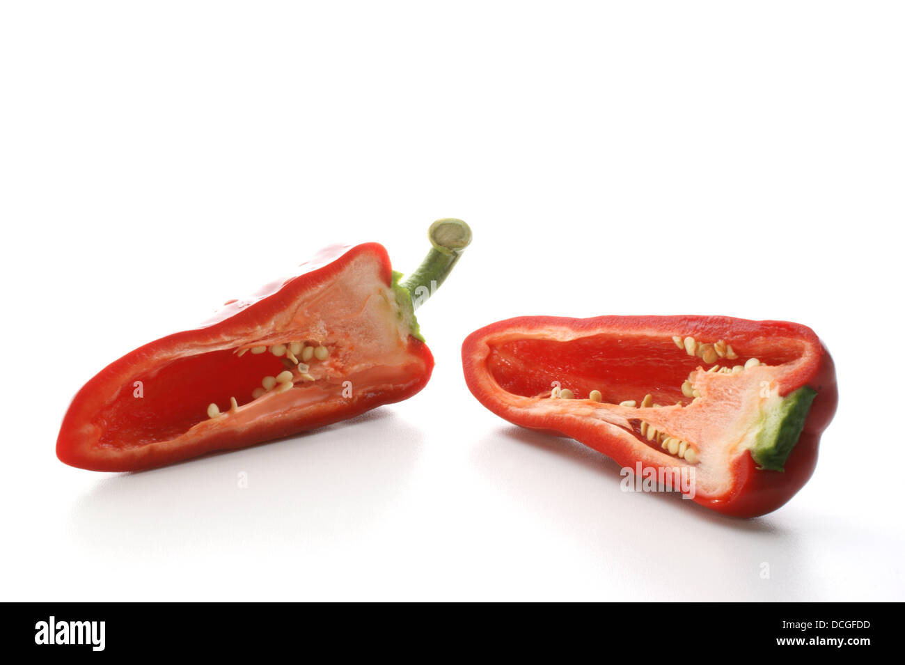fresh red paprika cut into half Stock Photo - Alamy