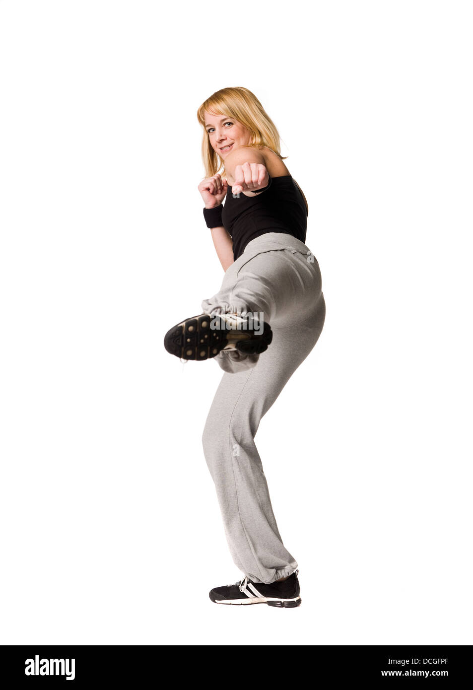 Girl doing a kick Stock Photo - Alamy