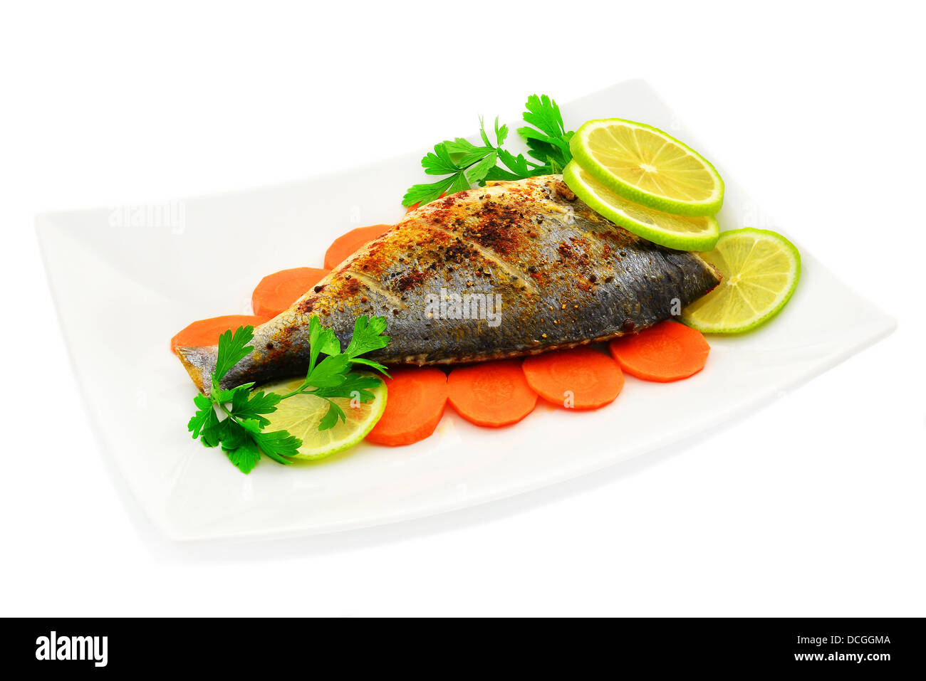 Baked fish with fresh lemon and carrots Stock Photo - Alamy