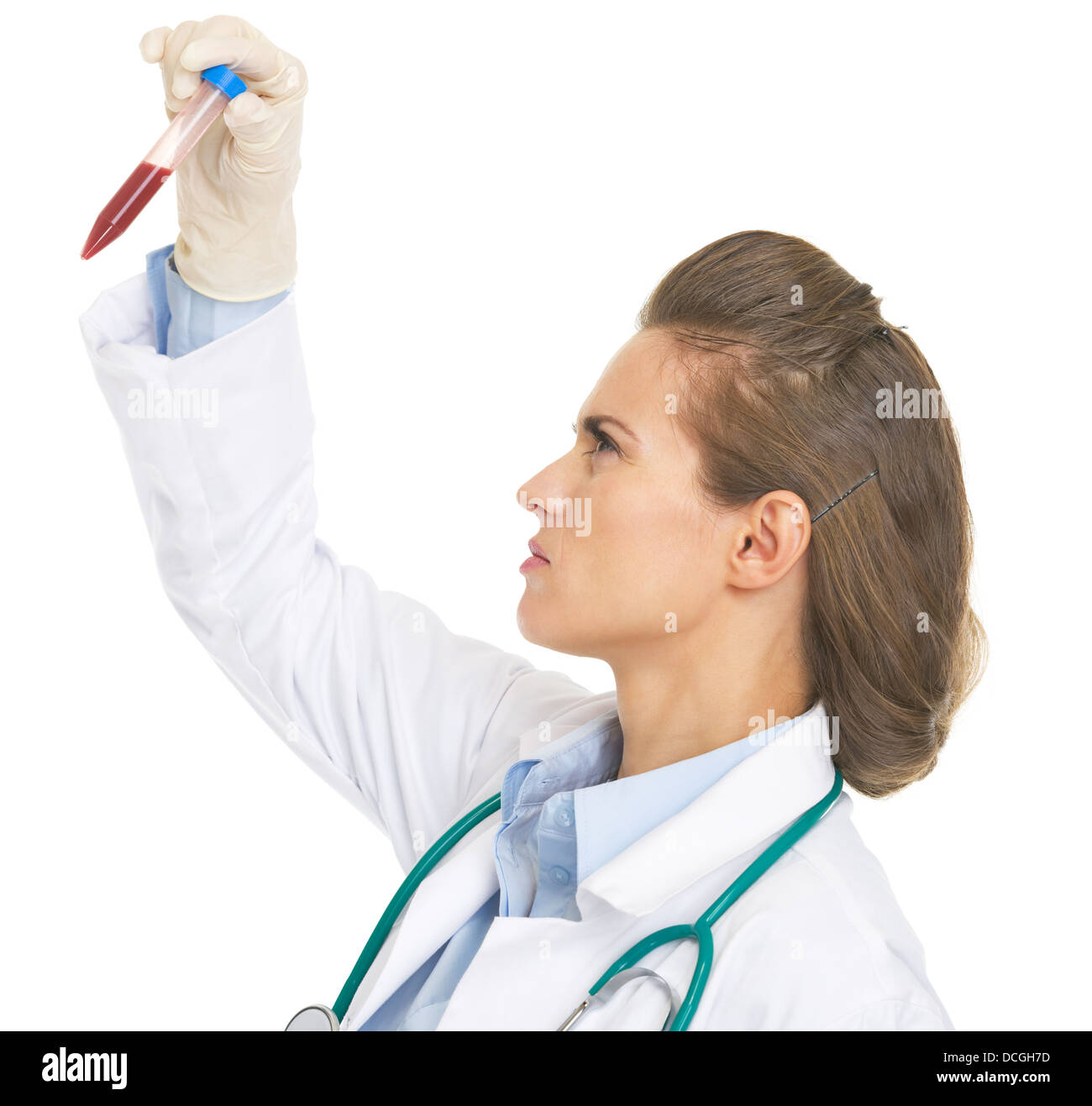 Serious doctor woman checking test tube Stock Photo - Alamy